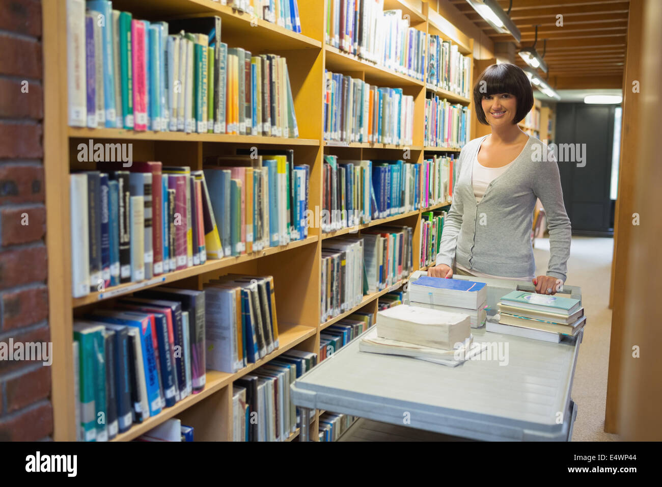 Putting book back hi-res stock photography and images - Alamy