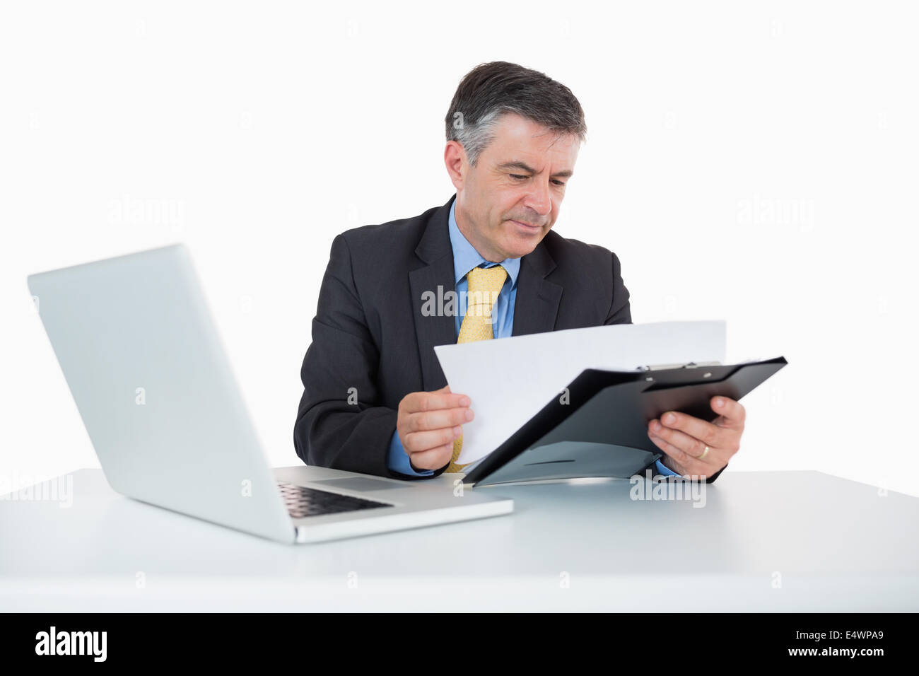 Mature executive reading documents hi-res stock photography and images ...