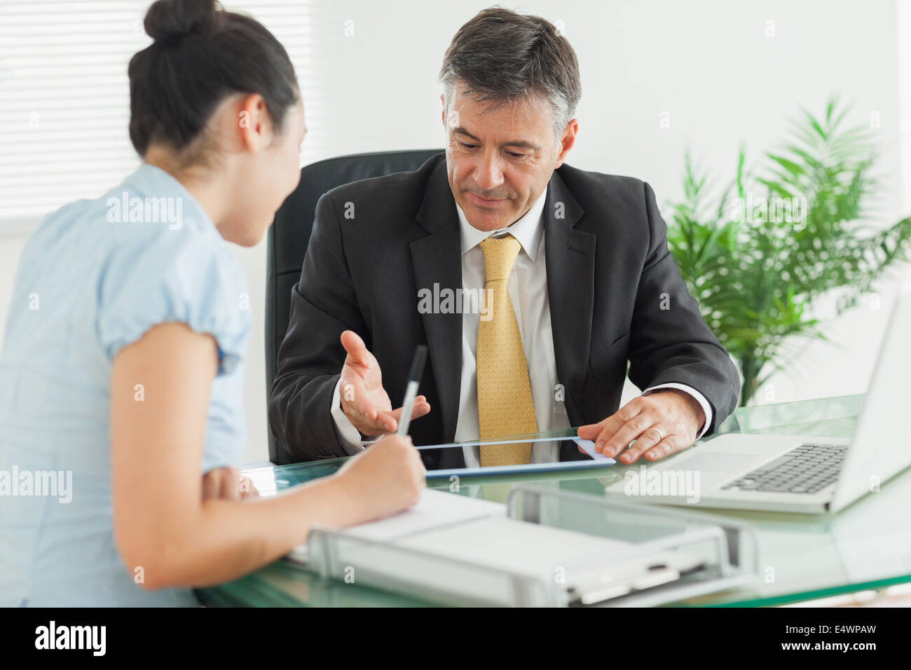 Business people explaining something at work Stock Photo - Alamy