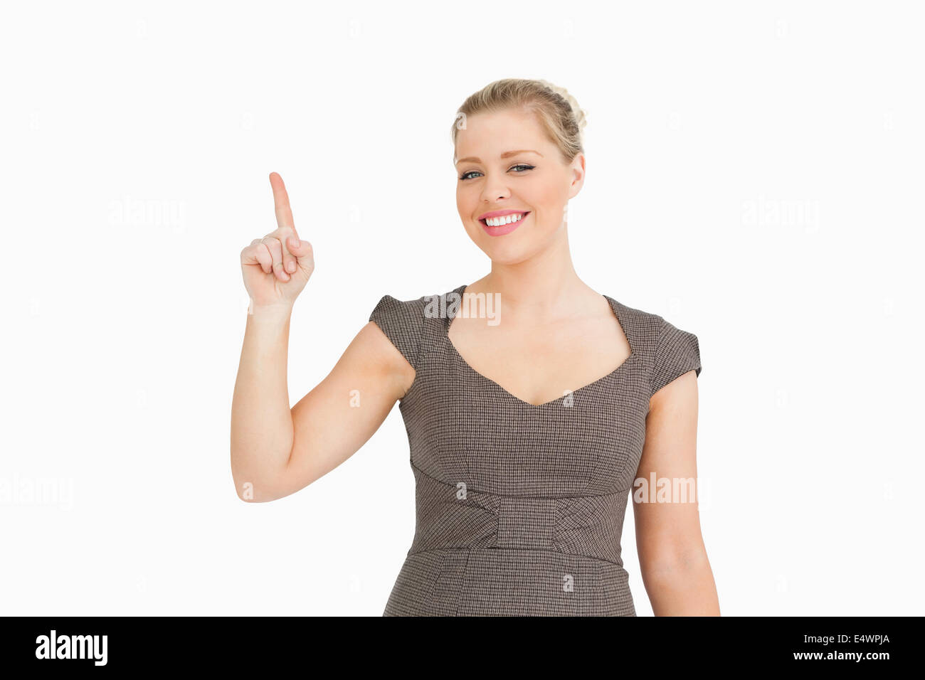 Pretty woman pointing something up Stock Photo - Alamy