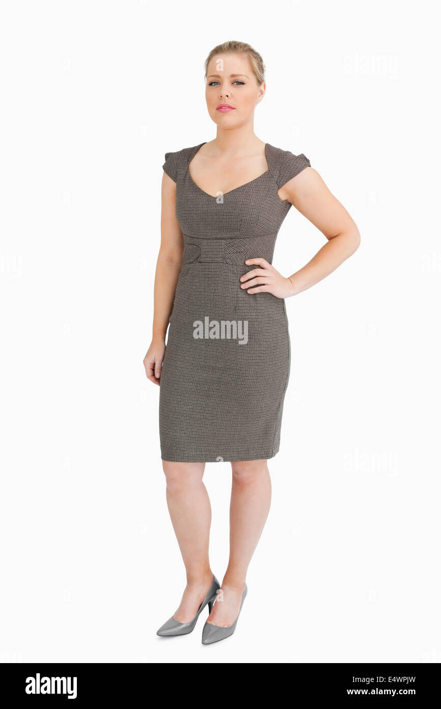 Serious woman standing Stock Photo - Alamy