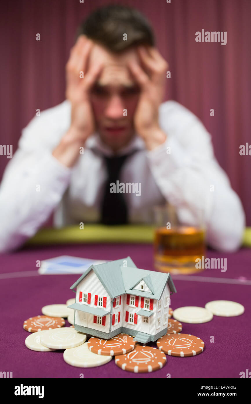 Man losing his house in casino Stock Photo - Alamy