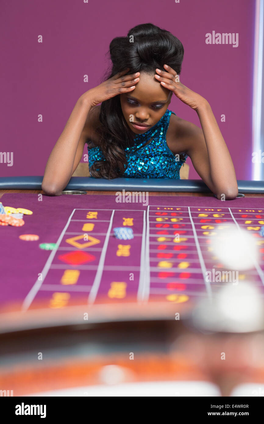 Woman losing at roulette Stock Photo - Alamy