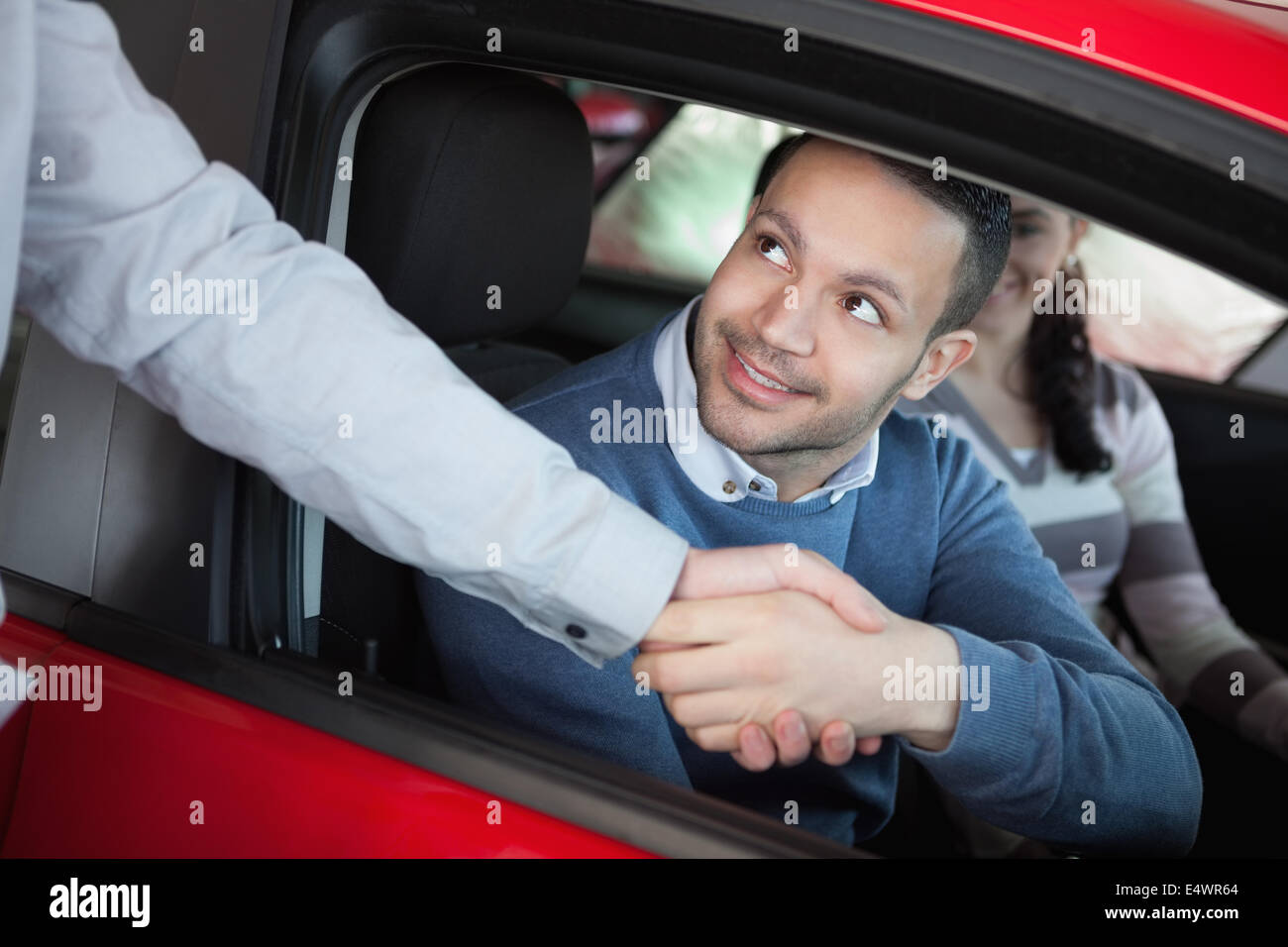 Joyful businessman shaking a hand Stock Photo - Alamy