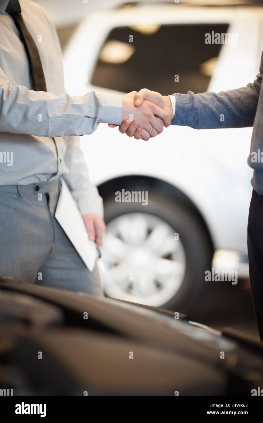 Two hands shaking car in hi-res stock photography and images - Alamy