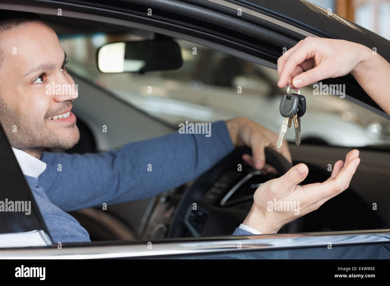 Man receiving keys Stock Photo - Alamy