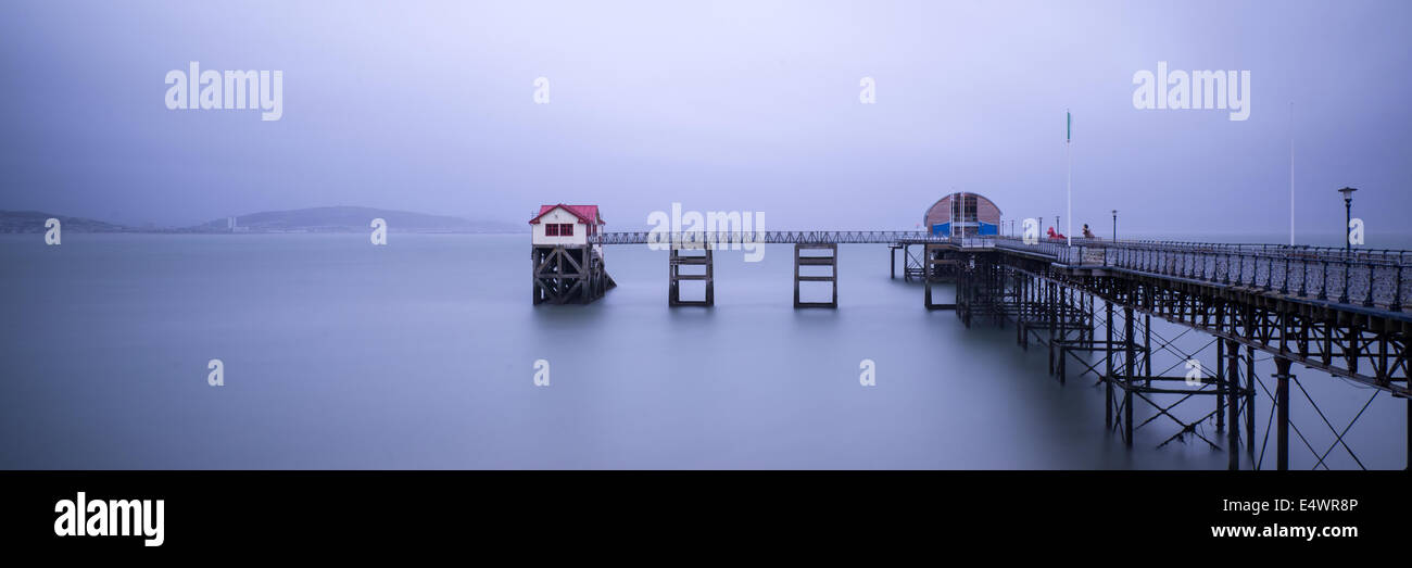 Landscape panorama long exposure moody image of Mumbles pier in Wales ...