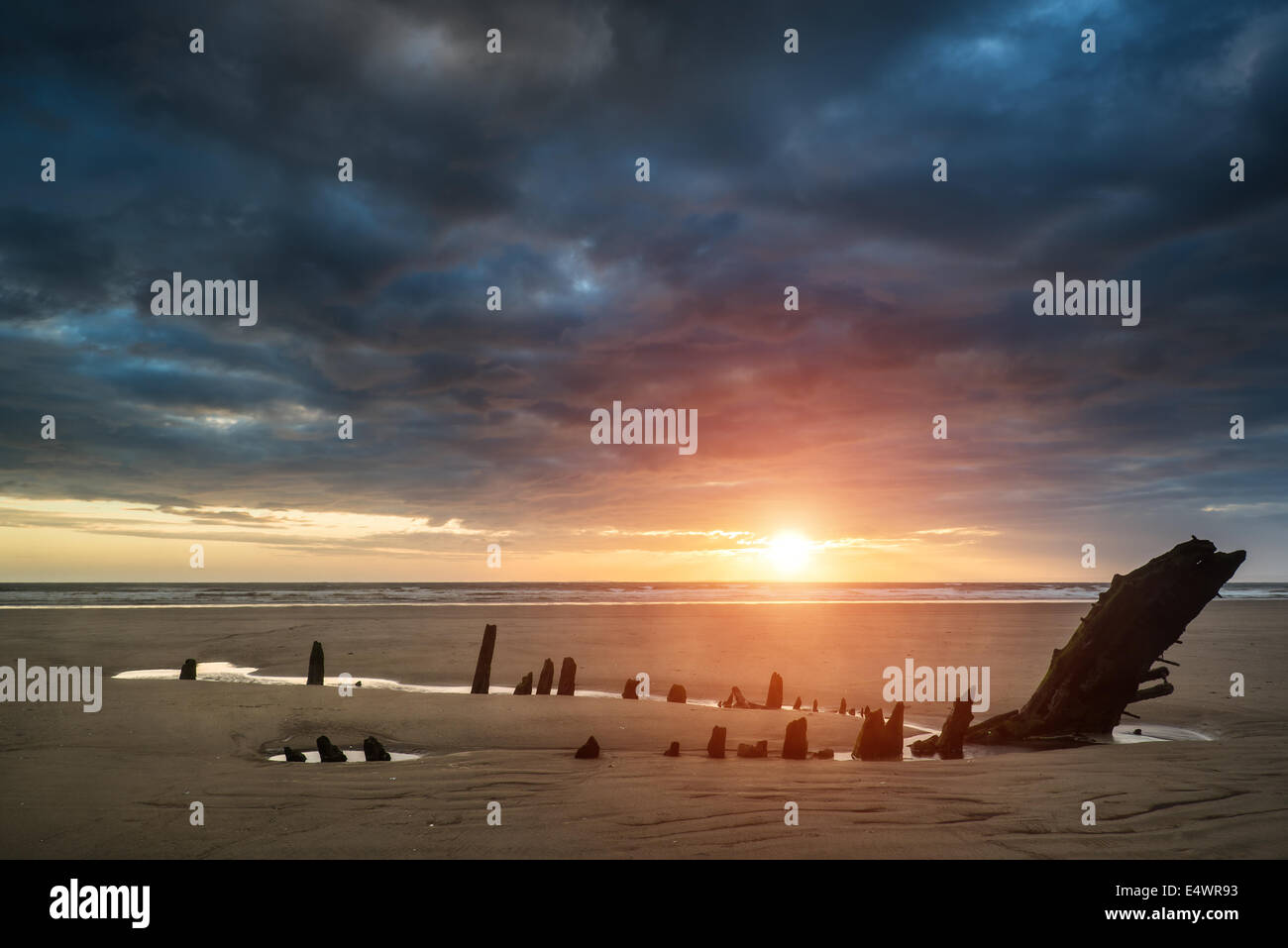 Dramatic sunset landscape over shipwreck on Rhosilli Bay beach Stock ...