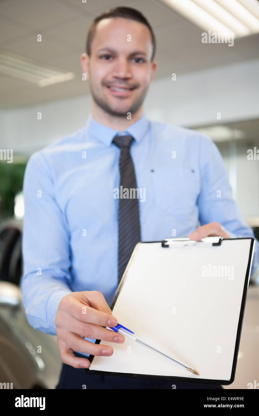 Salesman holding a contract Stock Photo - Alamy
