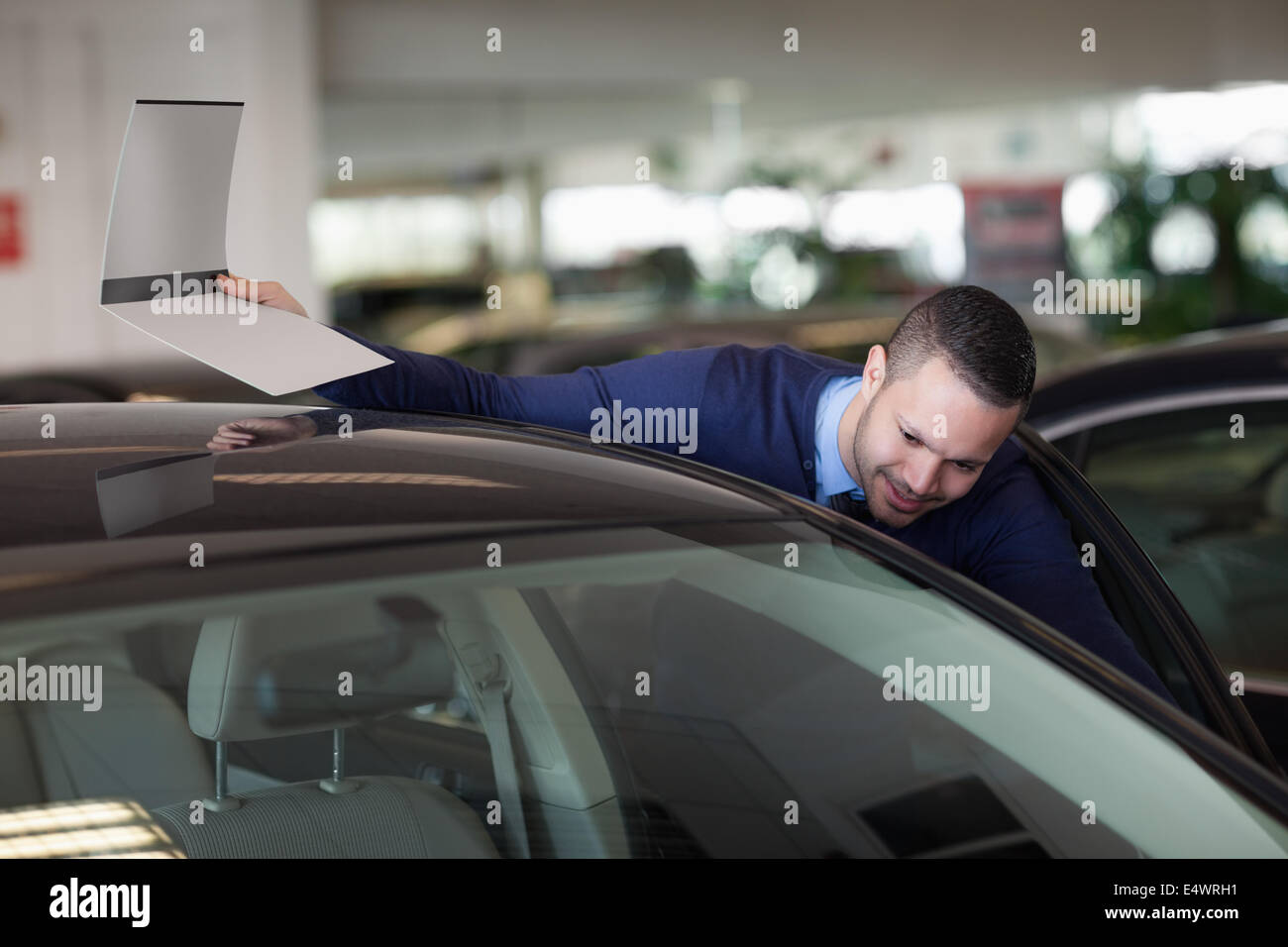 Man looking inside the car Stock Photo - Alamy