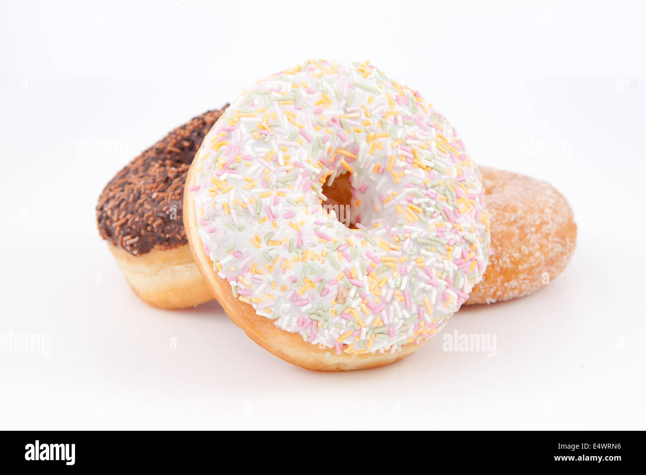 Three doughnuts with icing sugar Stock Photo - Alamy