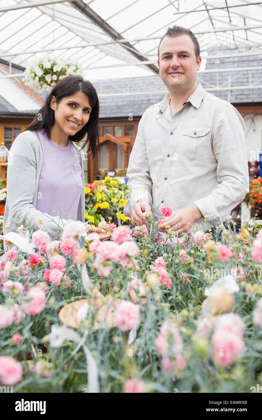 Young couple choosing flowers hi-res stock photography and images - Alamy