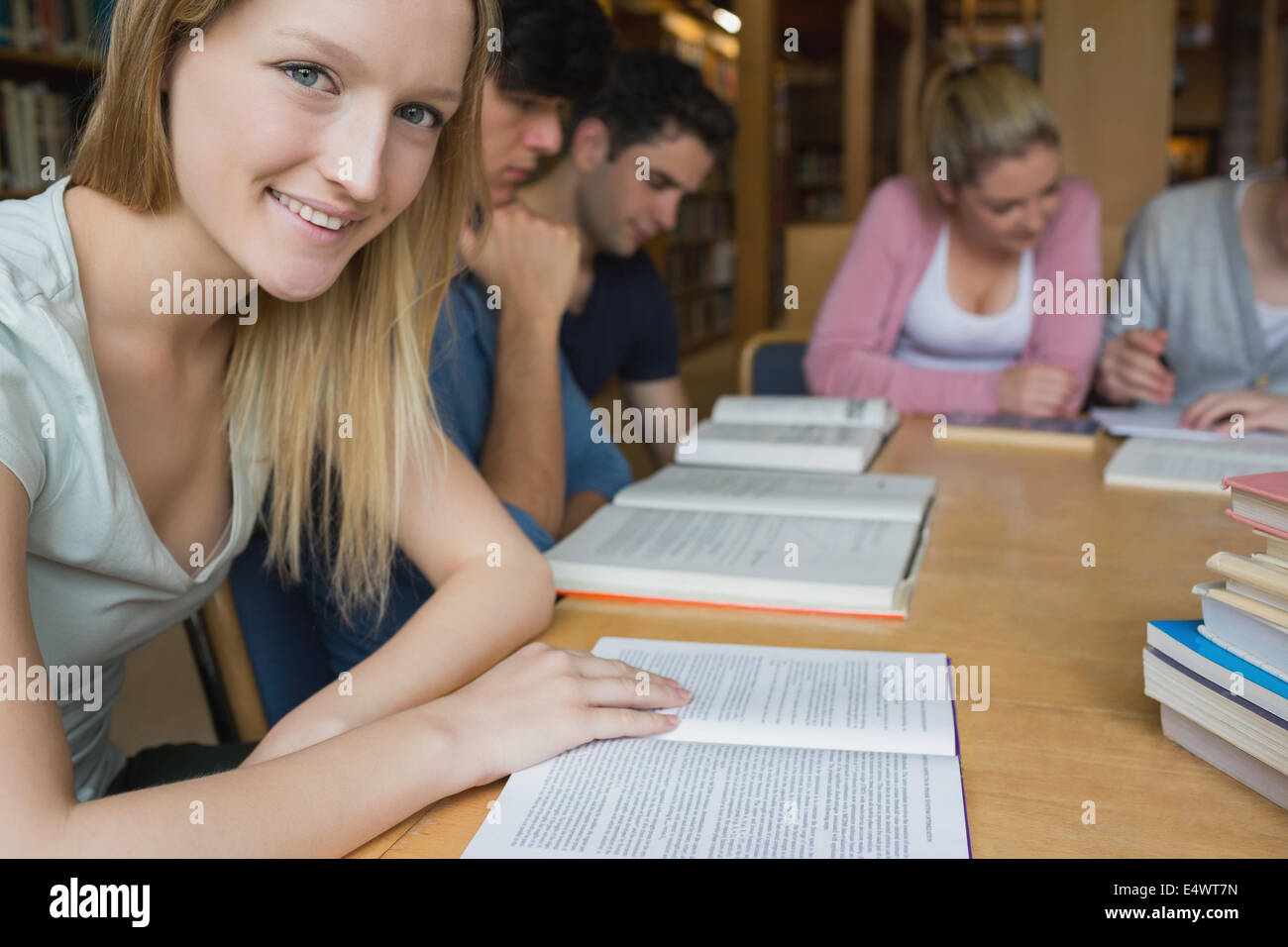 Smiling student with study group Stock Photo - Alamy