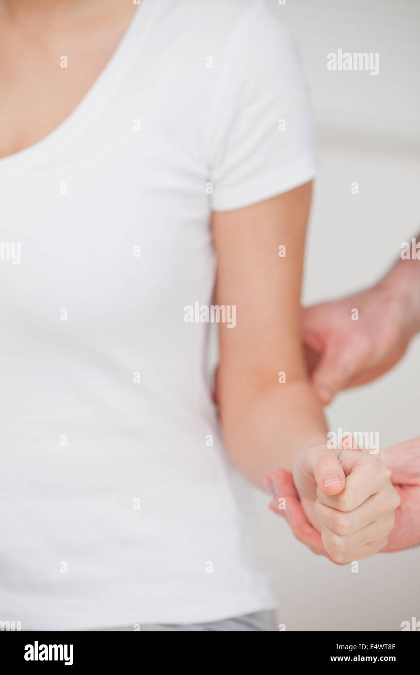 Woman sitting while being massaged Stock Photo - Alamy
