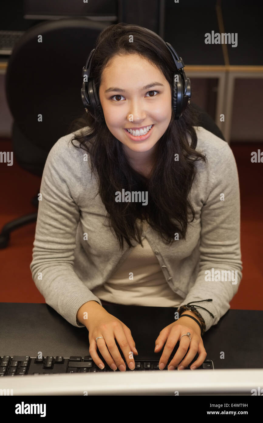 Girl sitting at the computer Stock Photo - Alamy