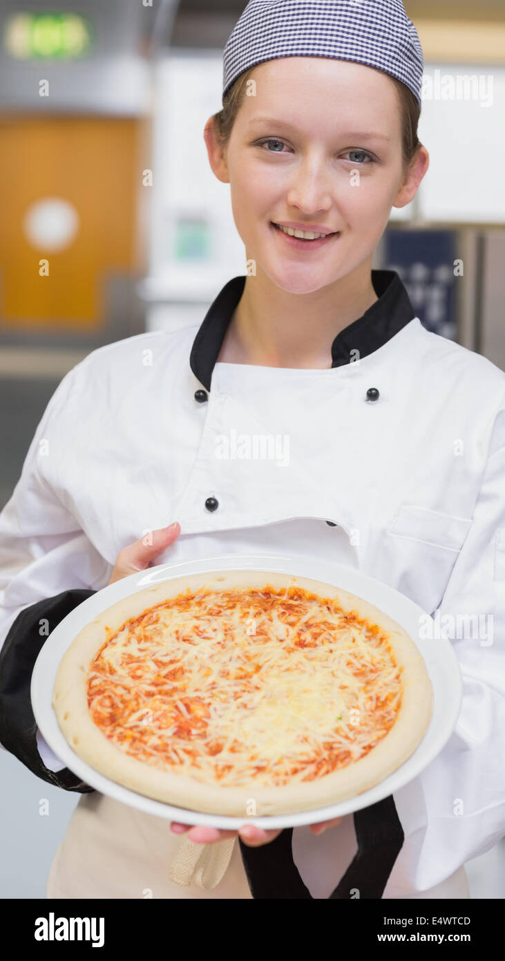 Chef presenting a pizza Stock Photo - Alamy