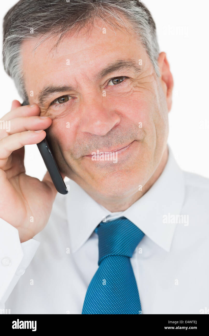 Happy man on mobile phone Stock Photo - Alamy
