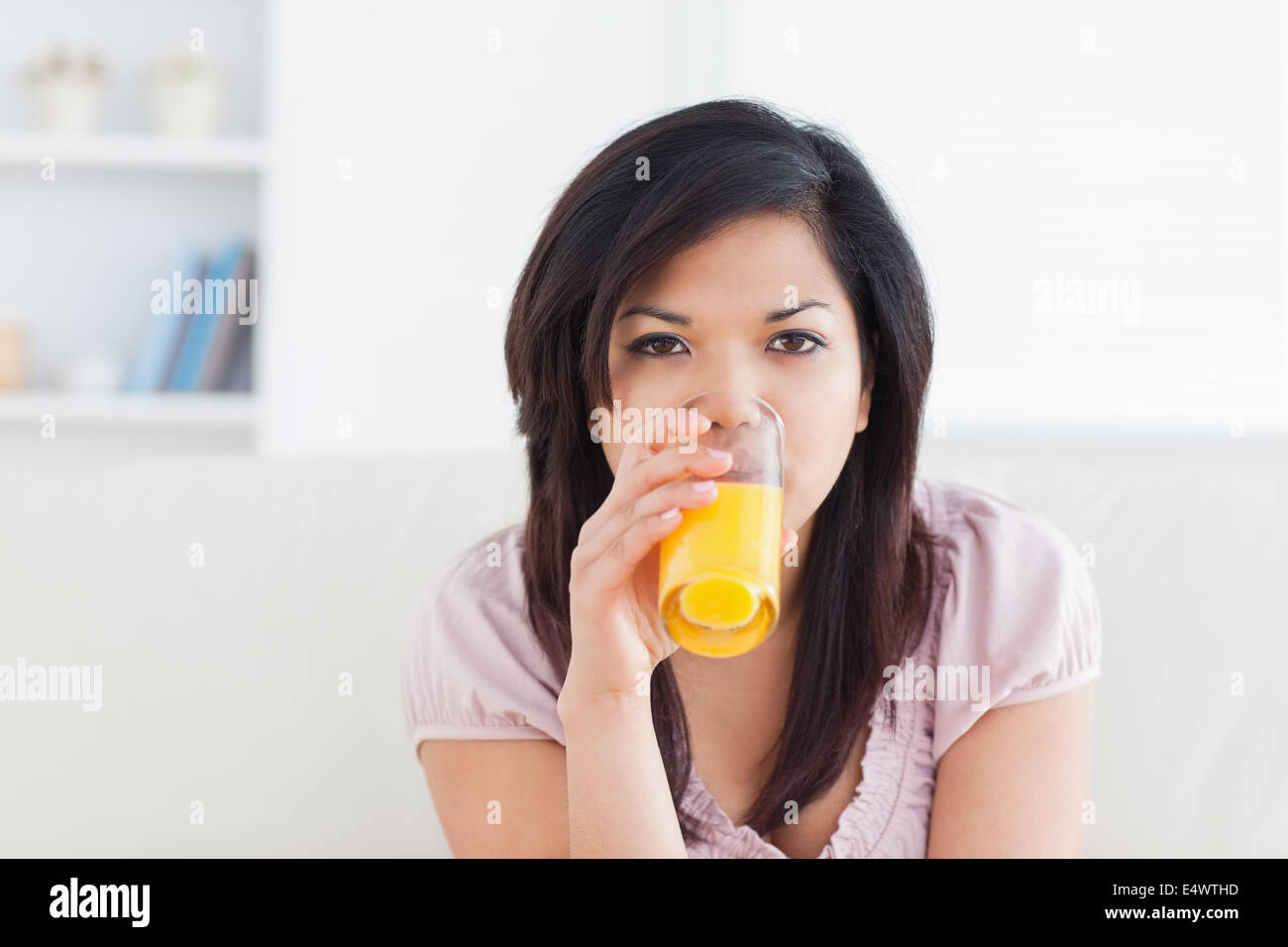 Asian woman drinking orange hi-res stock photography and images - Alamy