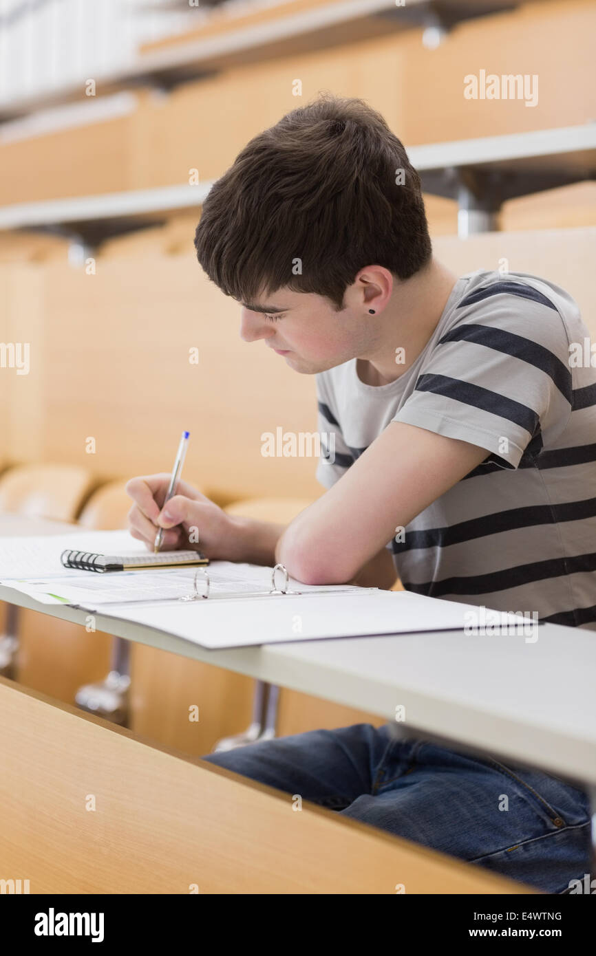 Concentrated student writing notes hi-res stock photography and images ...