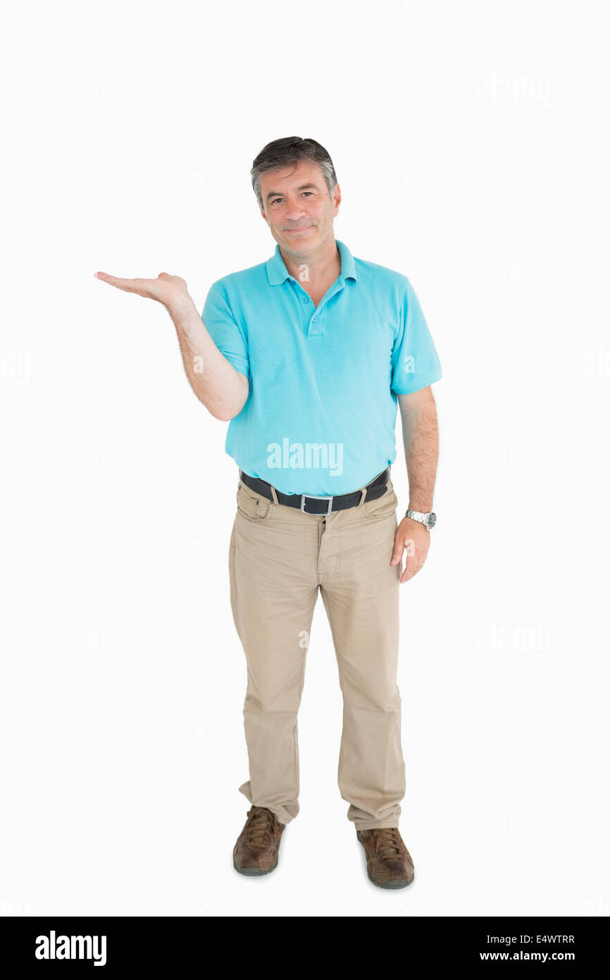 Smiling man raising his hand Stock Photo - Alamy