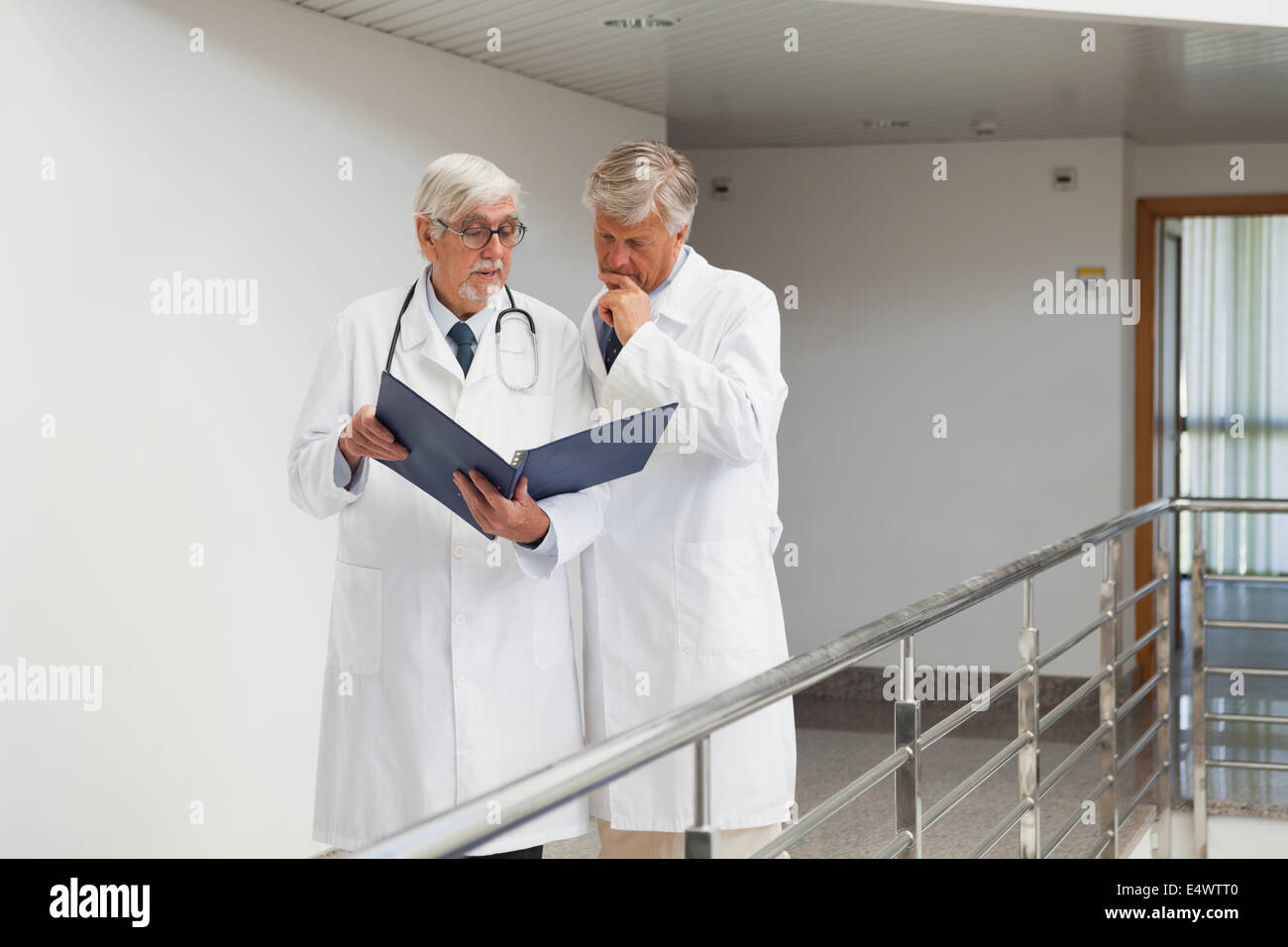 Doctor talking patient white wall hi-res stock photography and images ...