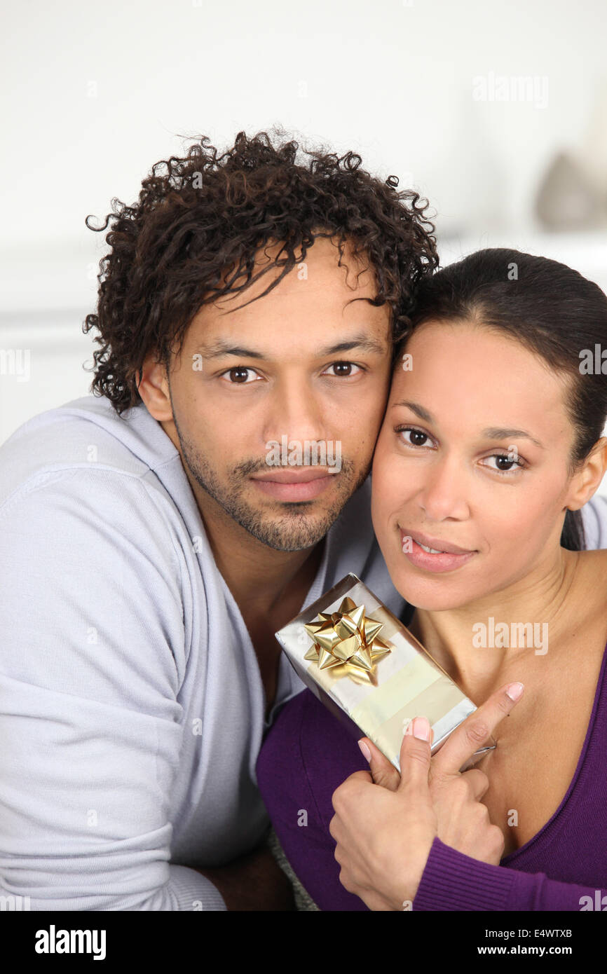 Couple gift giving Stock Photo - Alamy