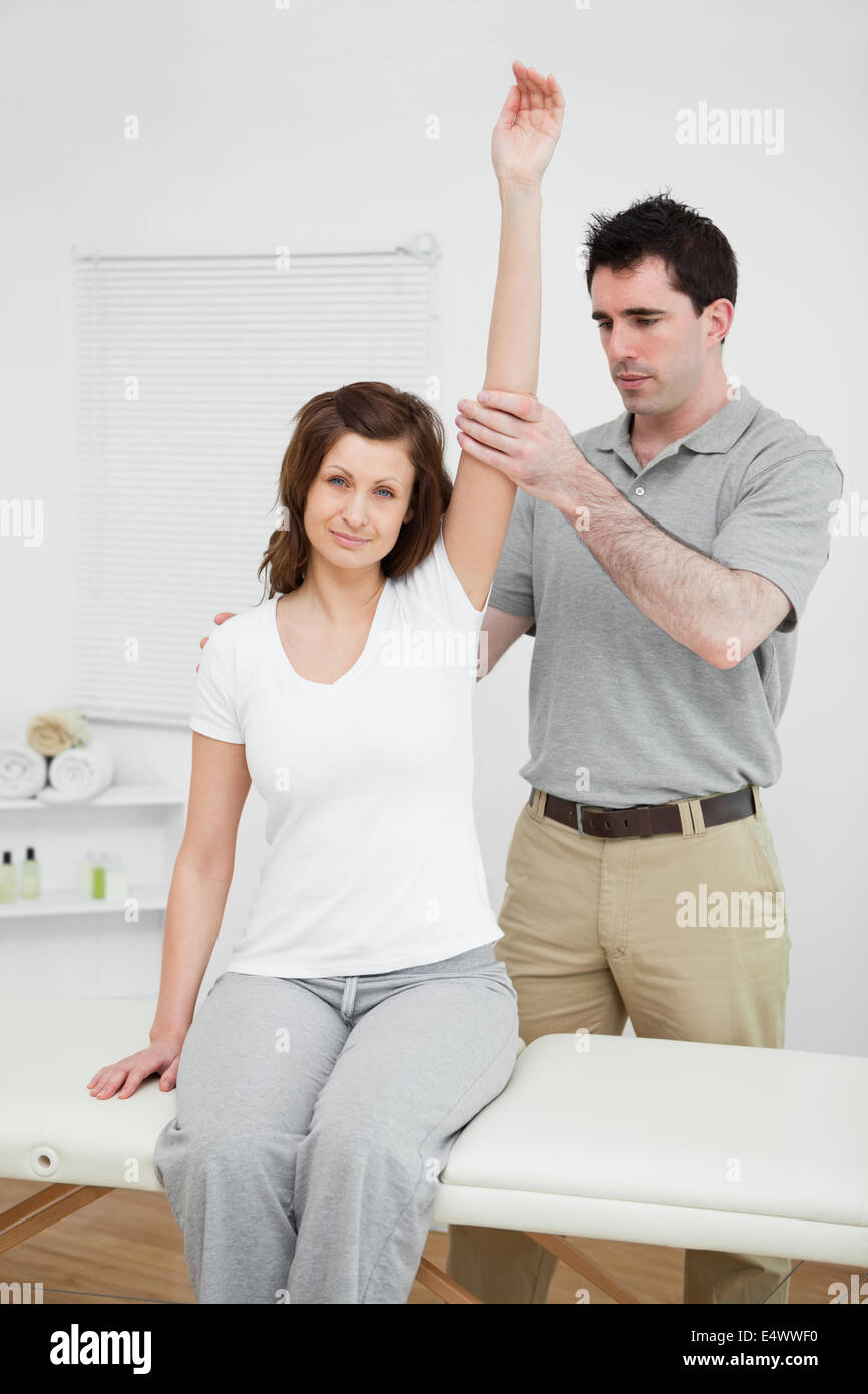 Peaceful woman keeping her arm up Stock Photo - Alamy
