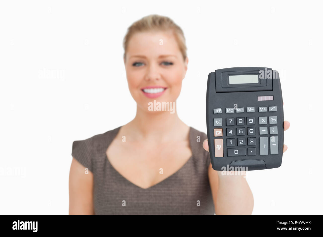 Woman showing a calculator in her hand Stock Photo - Alamy