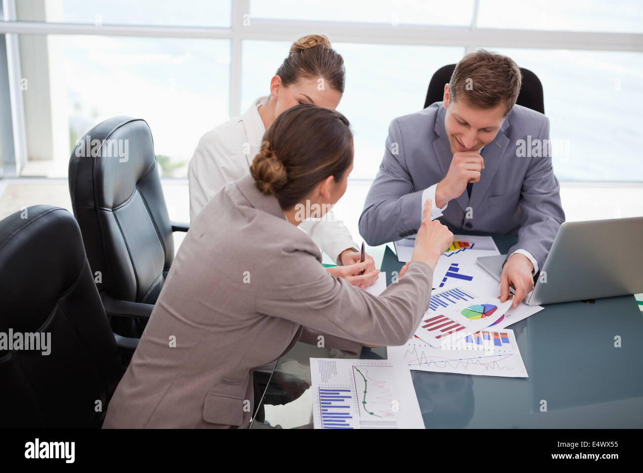 Business team discussing over market research Stock Photo - Alamy