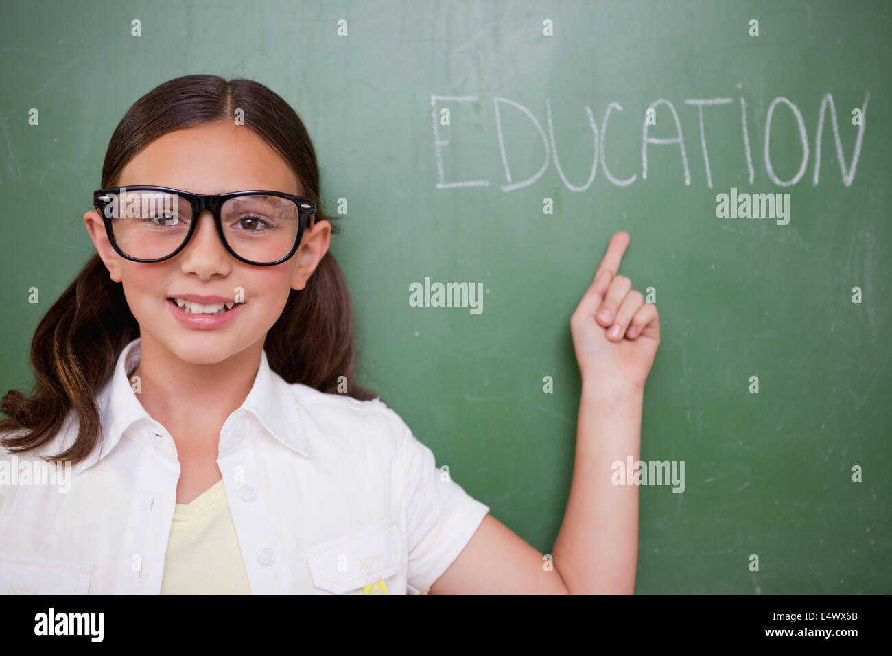 Girl pointing at word hi-res stock photography and images - Alamy