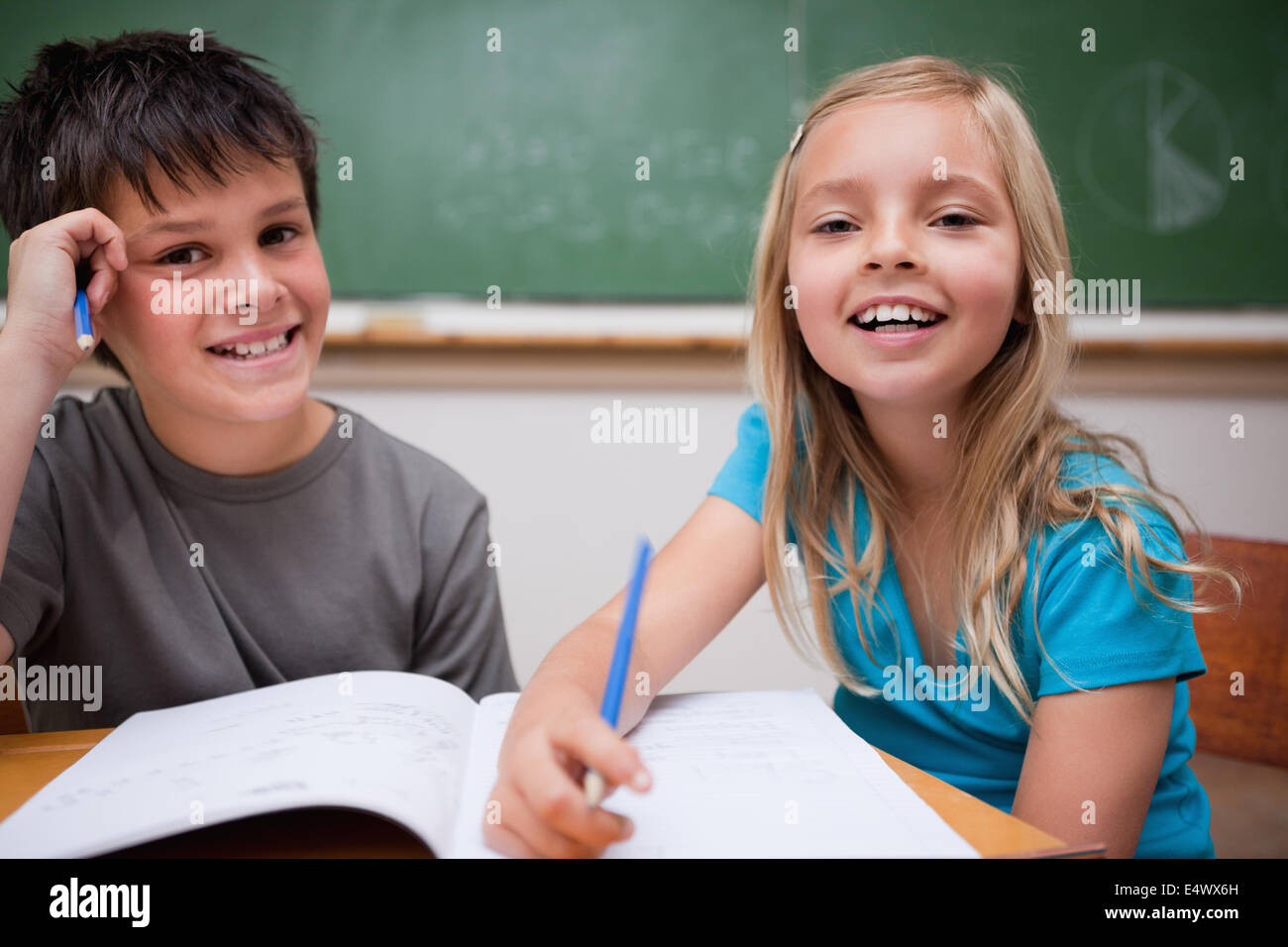 Two children reading classroom together hi-res stock photography and ...