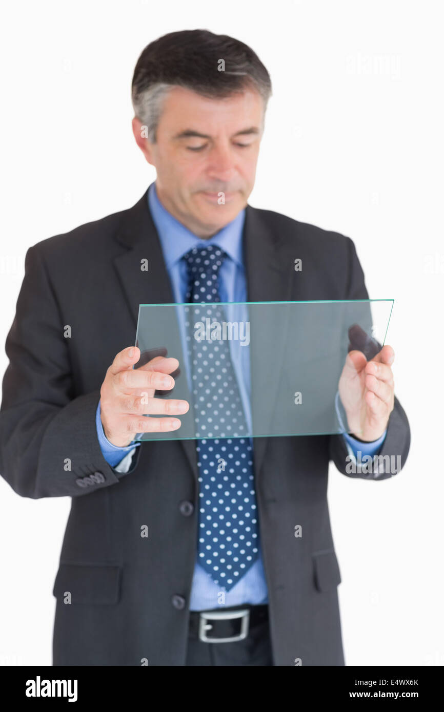 Businessman holding a glass slide Stock Photo - Alamy