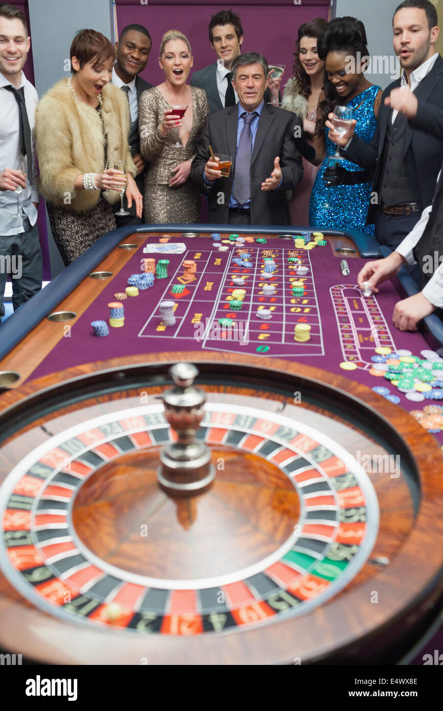 People standing at the roulette table Stock Photo - Alamy