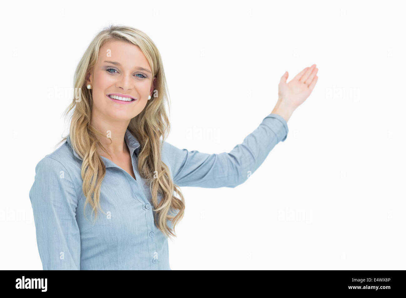 Young business woman presenting something hi-res stock photography and ...