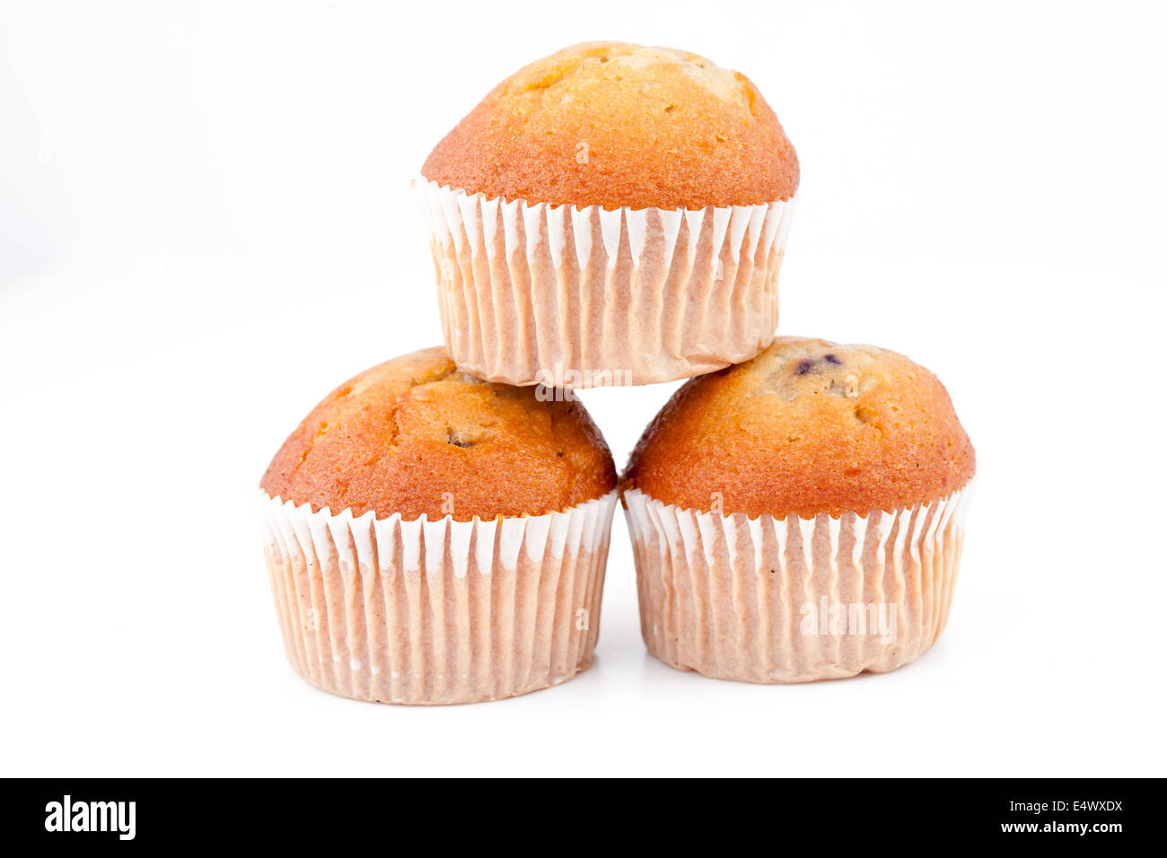 Three muffins piled up Stock Photo - Alamy