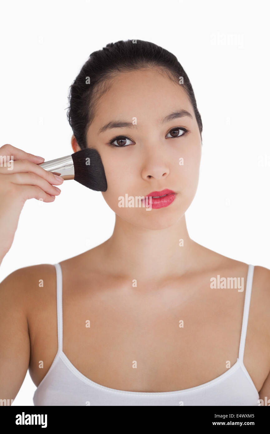 Woman applying powder hi-res stock photography and images - Alamy