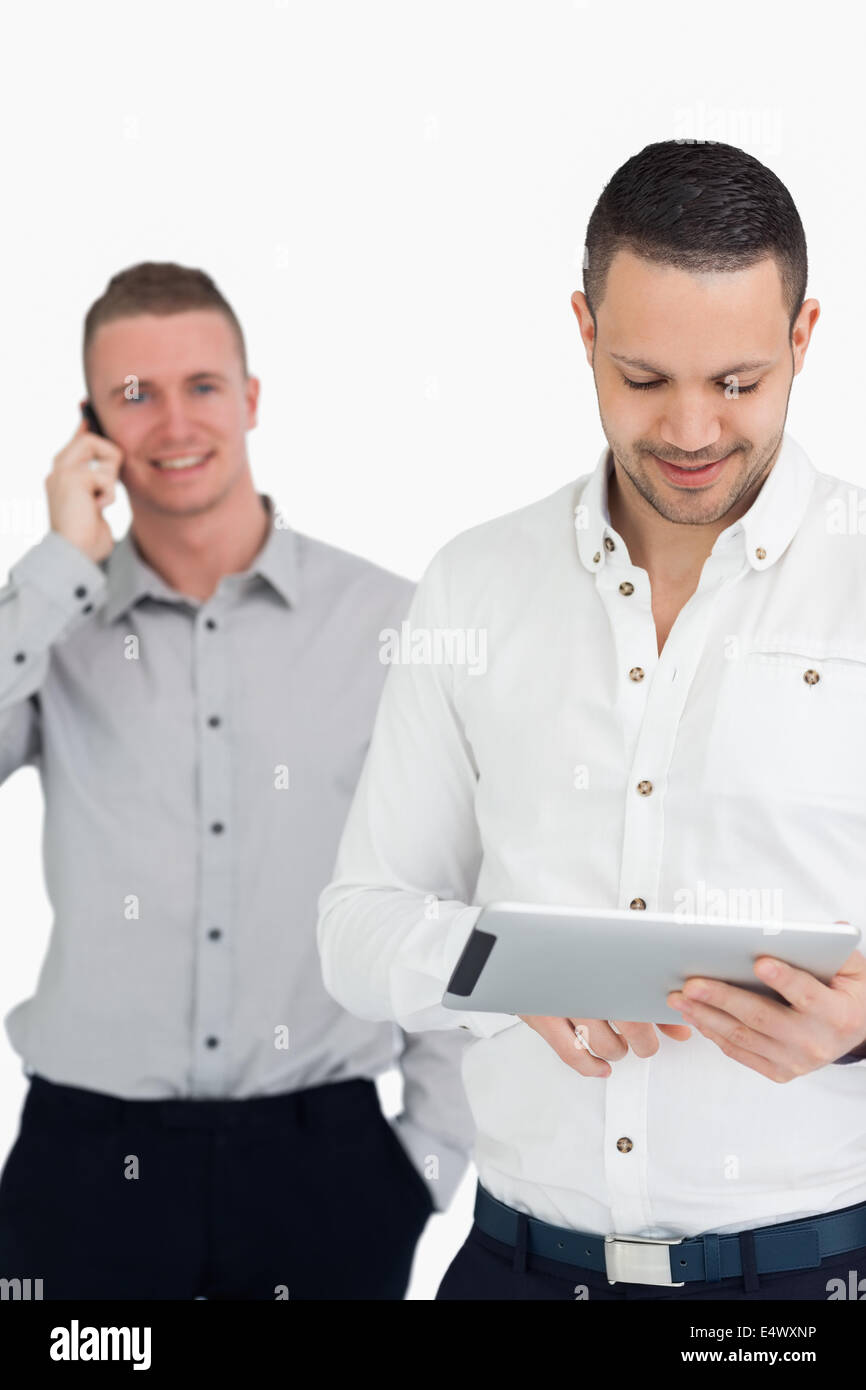 Men using phone and tablet computer Stock Photo - Alamy