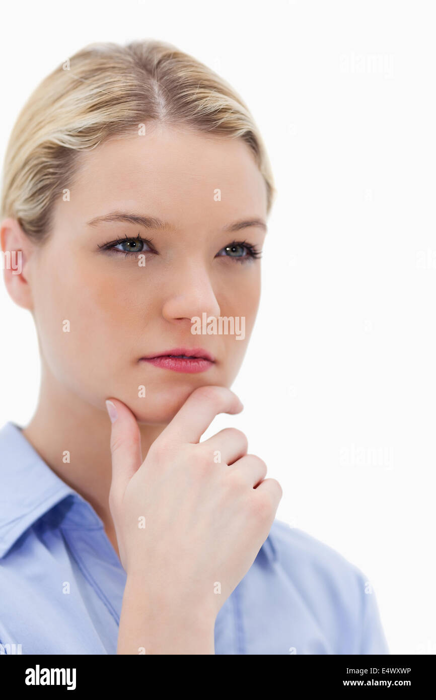 Thinking woman touching her chin Stock Photo - Alamy