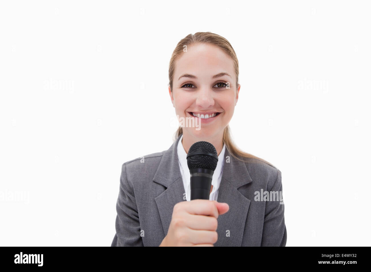 Smiling woman with microphone Stock Photo - Alamy