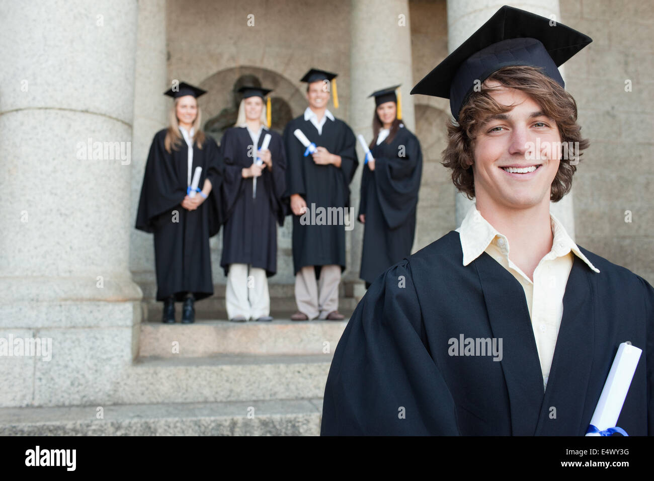 Male college graduate posing outdoors hi-res stock photography and ...