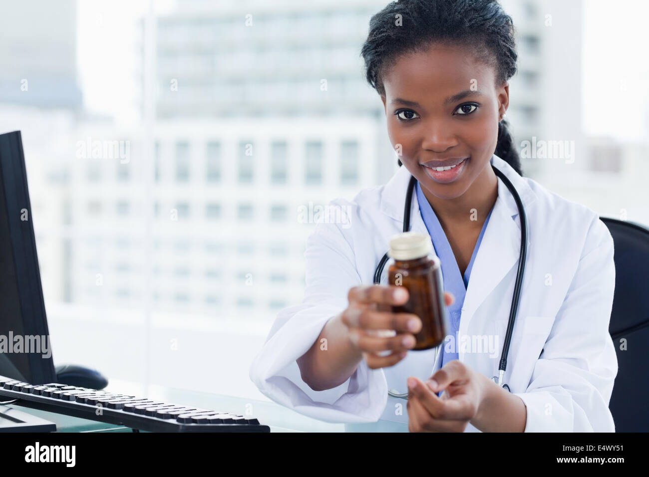 Young female doctor giving medication Stock Photo - Alamy