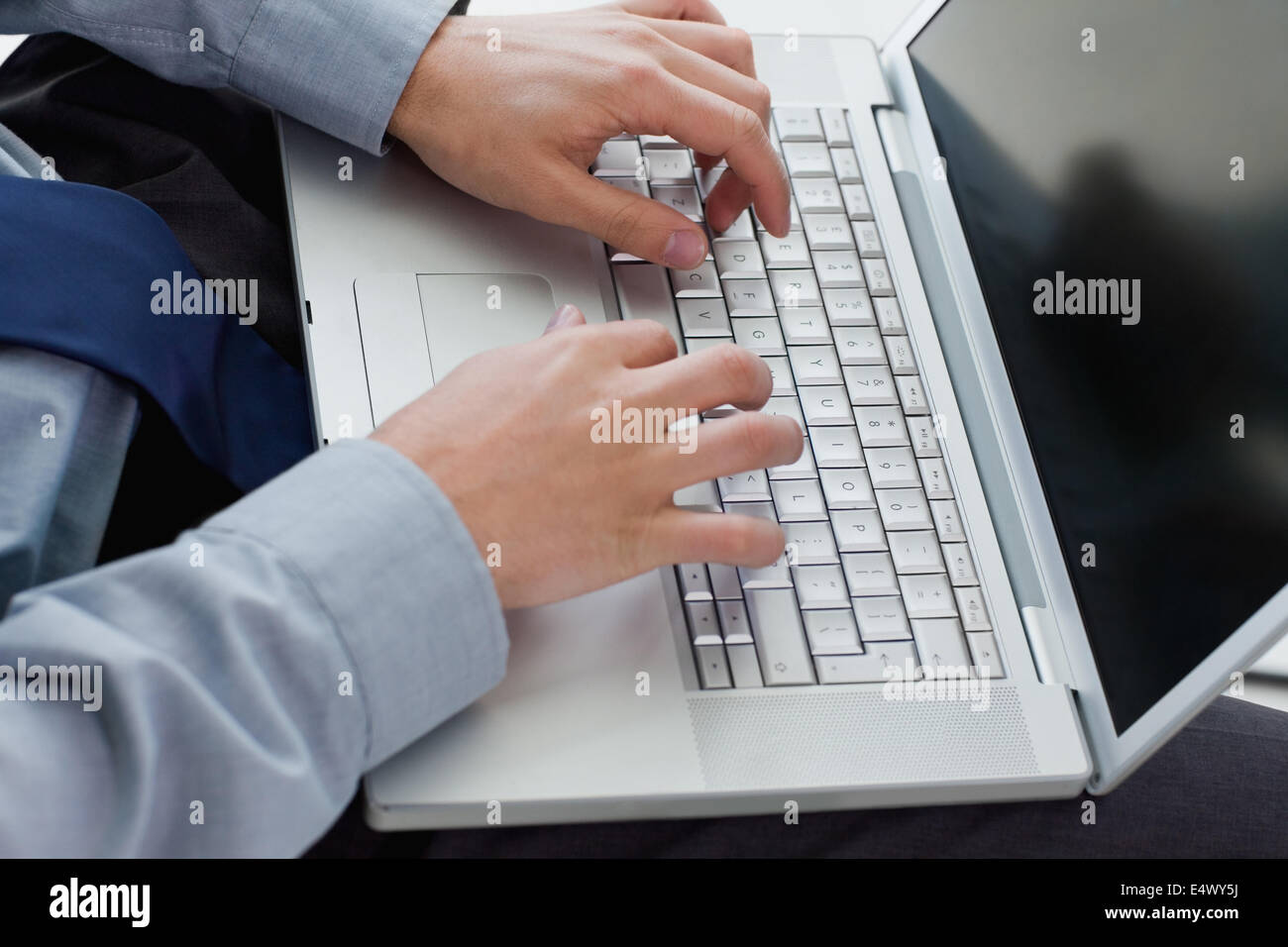 Hands typing on laptop Stock Photo - Alamy
