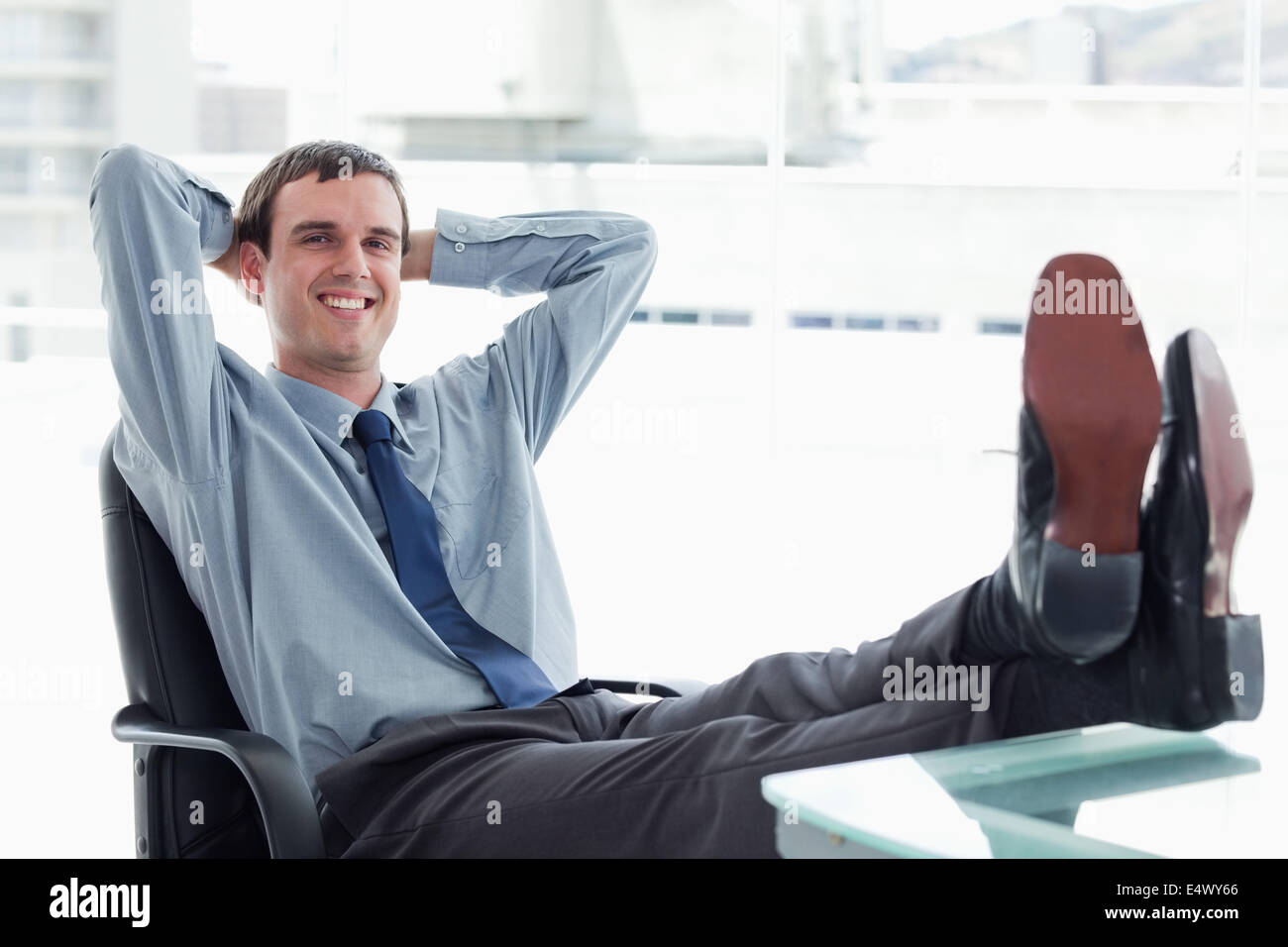 Blissful manager relaxing Stock Photo - Alamy