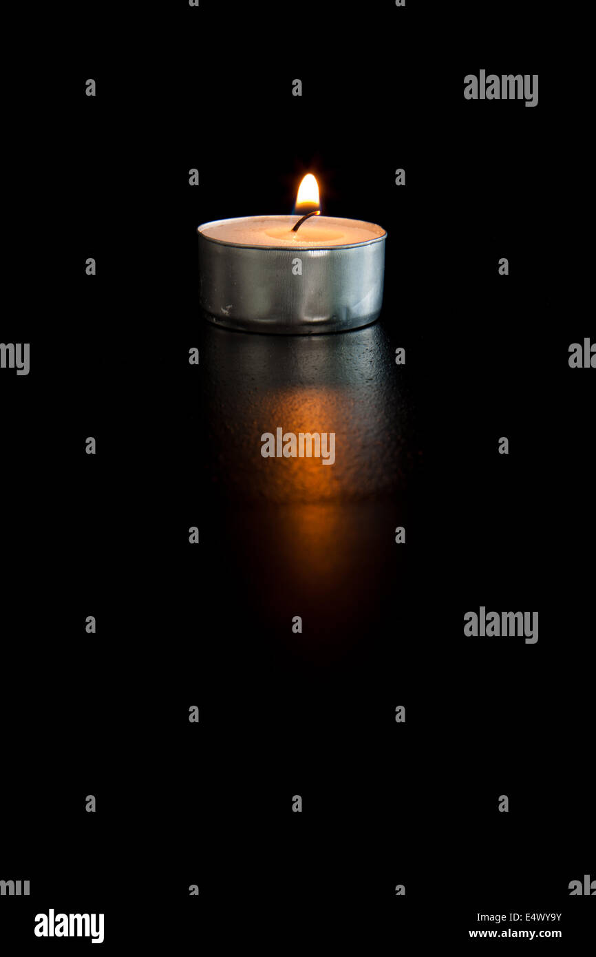 Lightened tea candle Stock Photo - Alamy