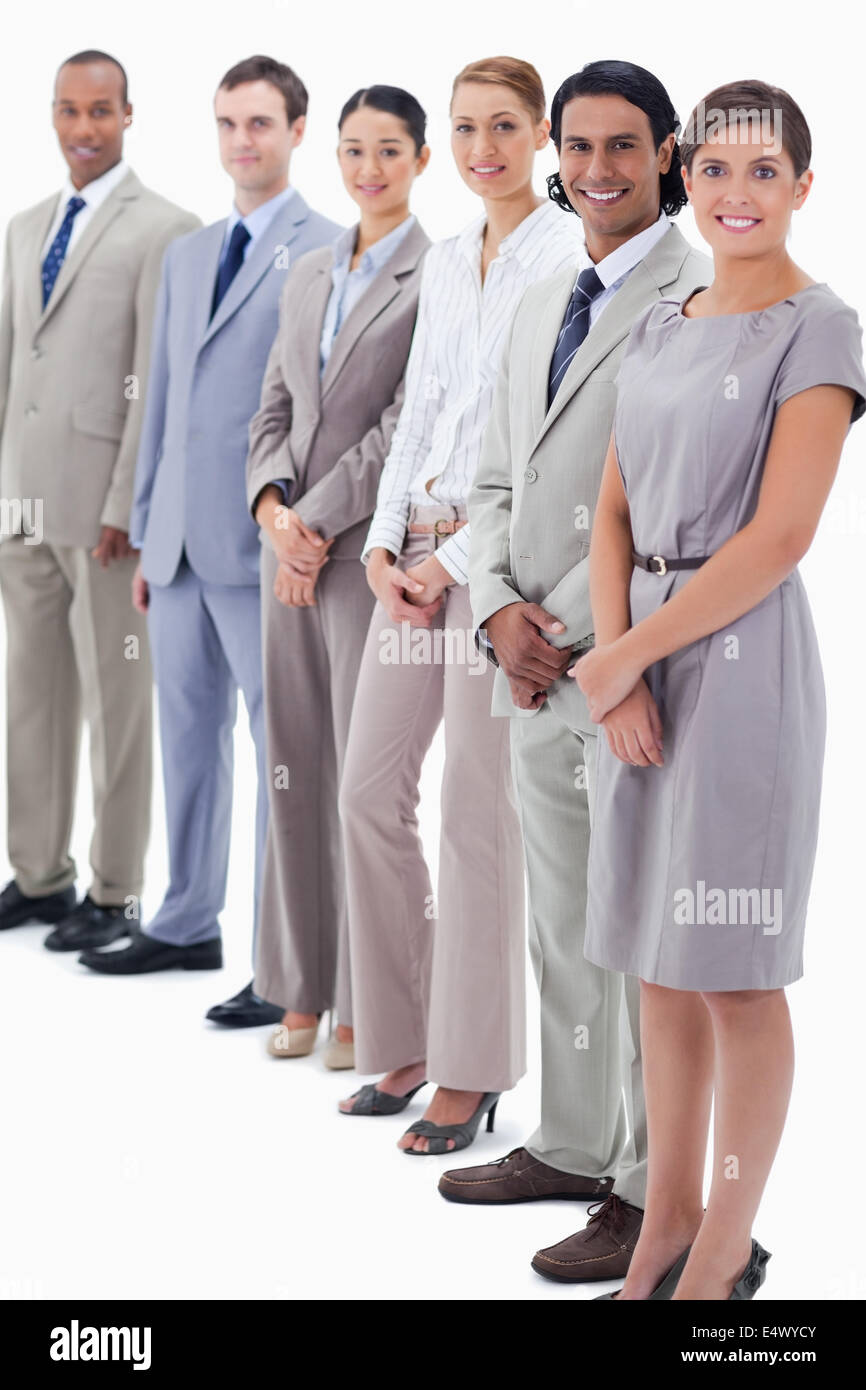 Colleagues smiling looking straight Stock Photo - Alamy