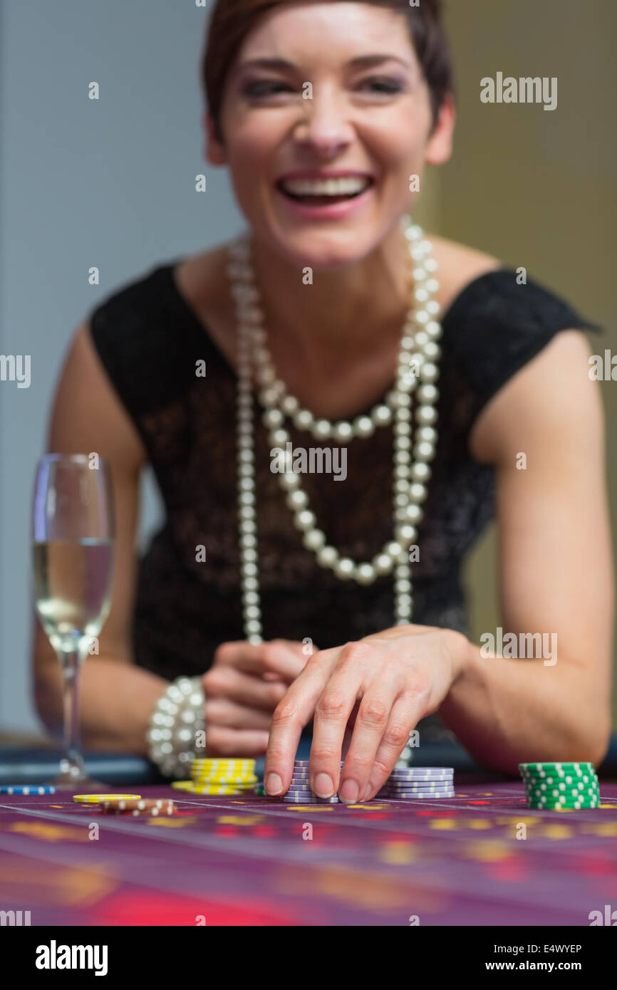 Woman laughing at table Stock Photo - Alamy