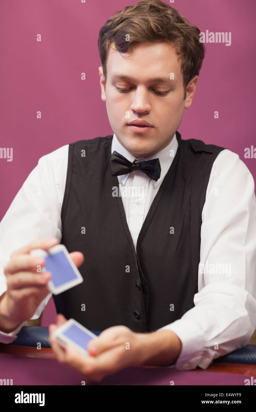 Young man dealing cards hi-res stock photography and images - Alamy