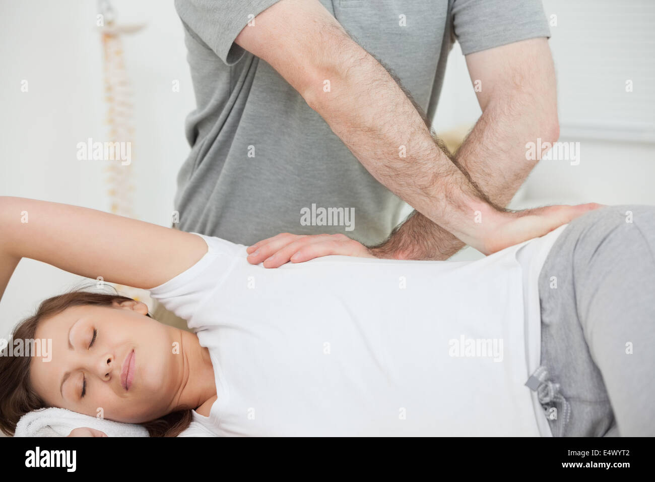 Smiling woman being massaged Stock Photo - Alamy
