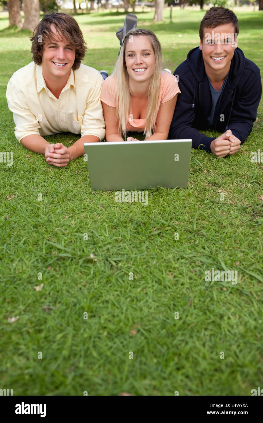 Three smiling students Stock Photo - Alamy