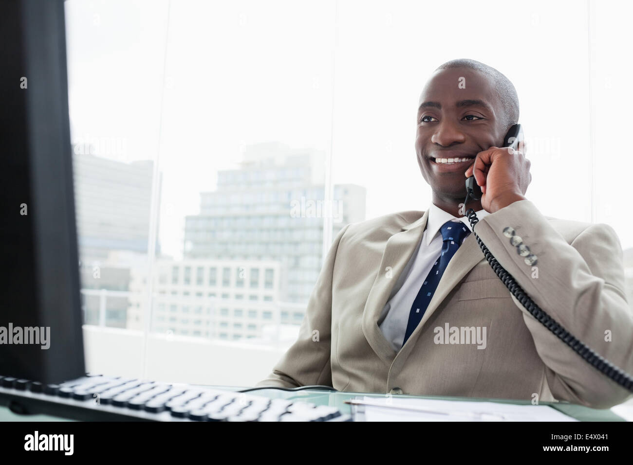 Smiling businessman on the phone Stock Photo - Alamy